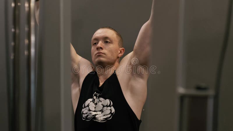 Muscular Male Athlete Exercising on Treadmills in the Modern Gym, Doing ...