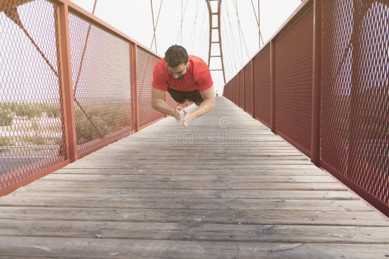 Man Training Push Ups on a Bridge Stock Image - Image of flooring ...
