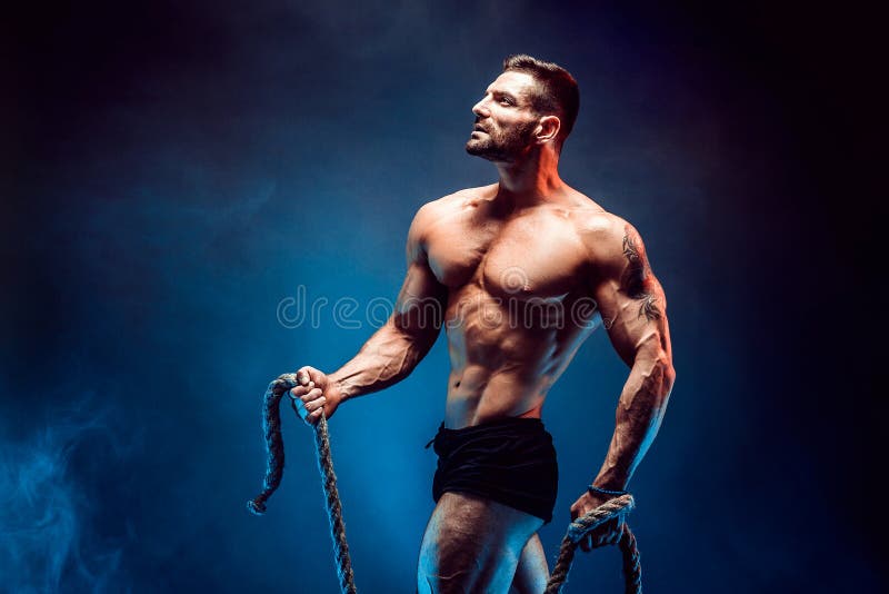 Man training with rope stock image. Image of muscular - 101576369