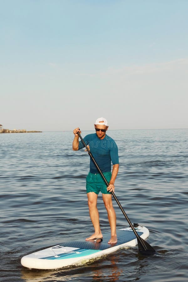 Man is Training on a SUP Board Stock Photo - Image of summer, healthy ...