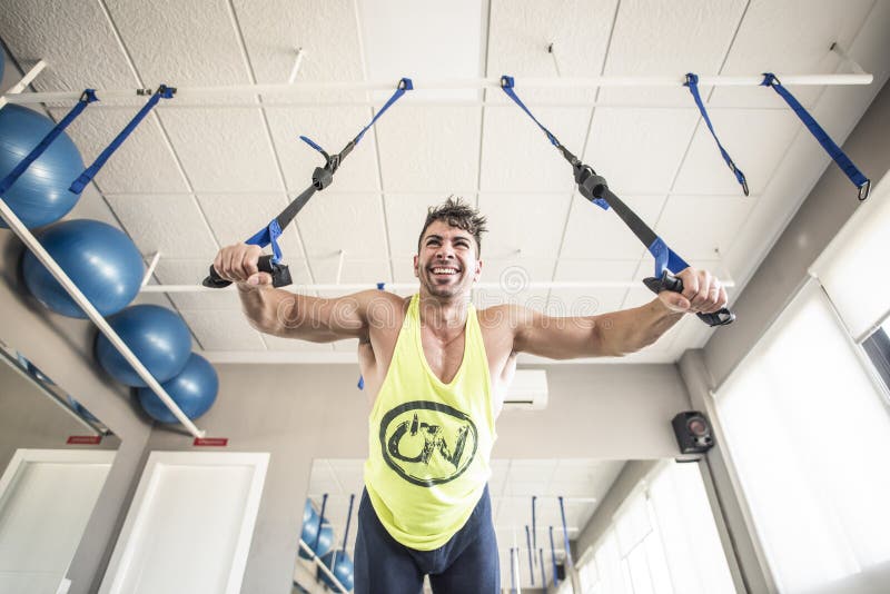 Man Training in Suspension Rope Stock Image - Image of fitness, studio ...
