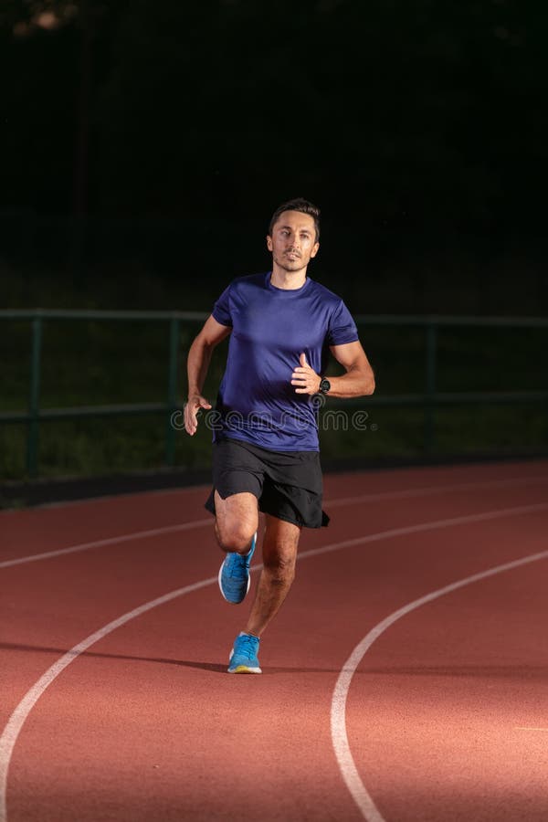 Man Training To Run on a Track and Field Stock Photo - Image of ...