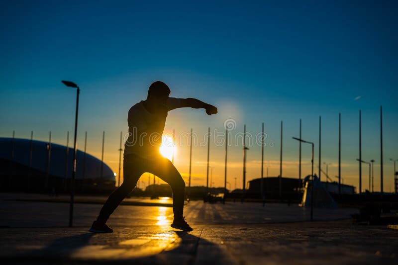 A Man Trains Boxing at Sunset Outdoors. Stock Photo - Image of daytime ...