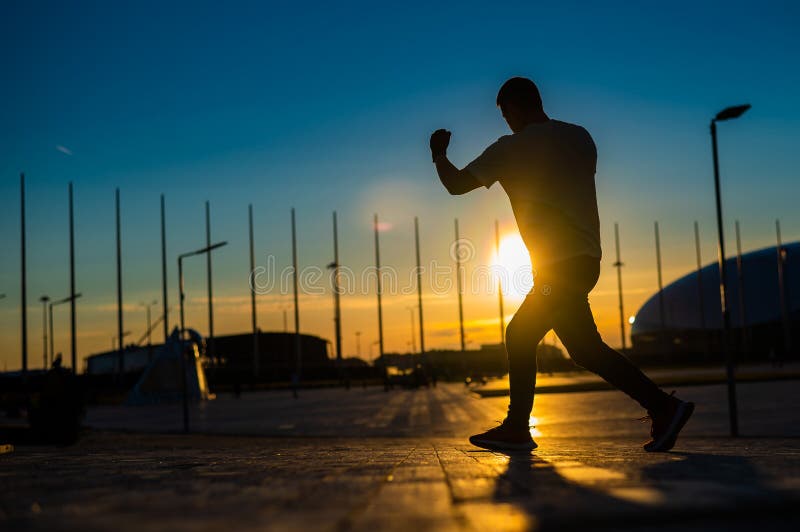 A Man Trains Boxing at Sunset Outdoors. Stock Photo - Image of healthy ...