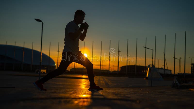 A Man Trains Boxing at Sunset Outdoors. Stock Image - Image of powerful ...