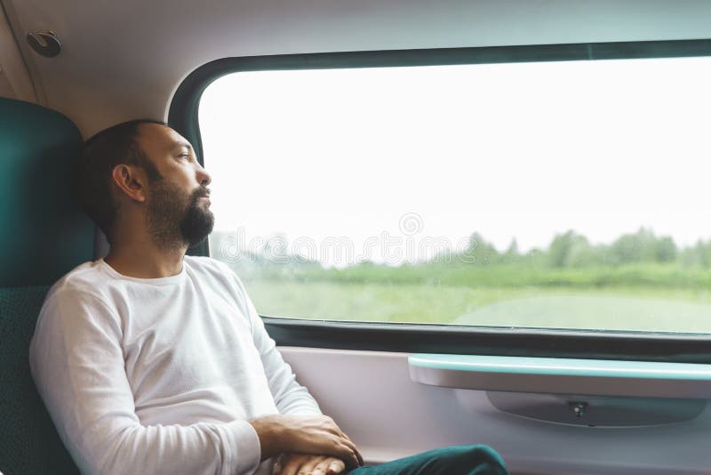 Man Looking Out Train Window Thinking Stock Photos - Free & Royalty ...