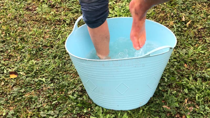 Man Treading Cold Water in a Bucket Stock Video - Video of naturopathy ...