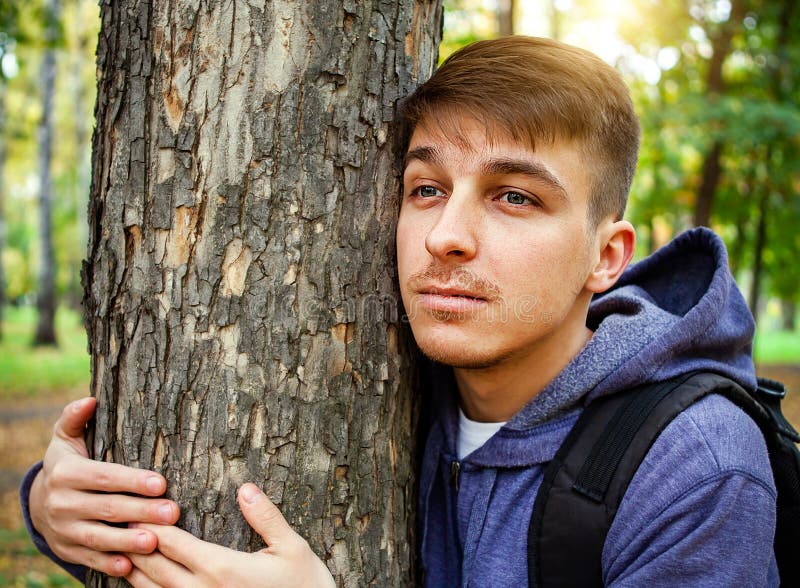 Man with a Tree stock image. Image of nature, pine, park - 215335663