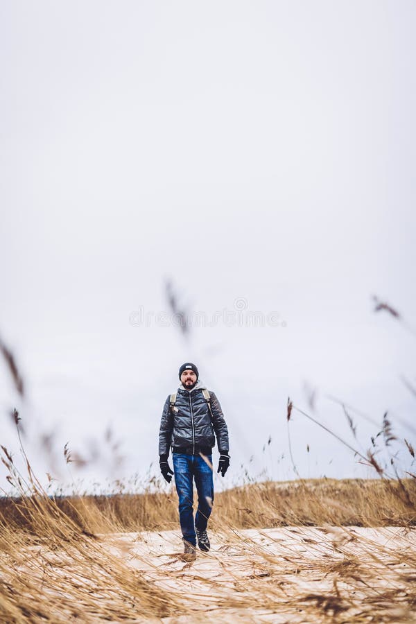 Man Trekking on Dunes by the Sea at Autumn Stock Image - Image of ...