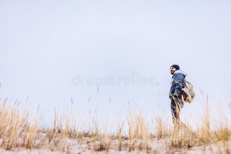 Man Trekking on Dunes by the Sea at Autumn Stock Photo - Image of ...