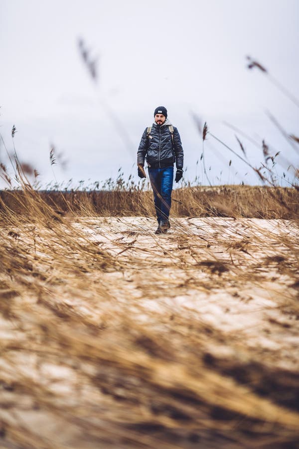 Man Trekking on Dunes by the Sea at Autumn Stock Image - Image of ...