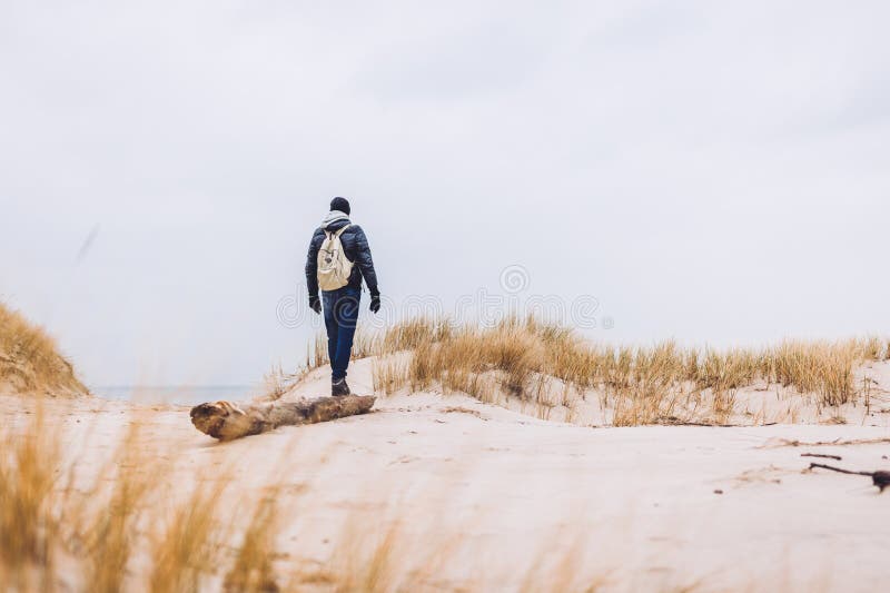 Man Trekking on Dunes by the Sea at Autumn Stock Image - Image of ...