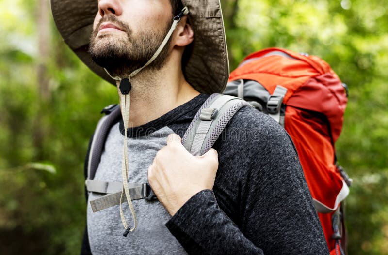 Man Trekking in a forest stock image. Image of lifestyle - 110813841