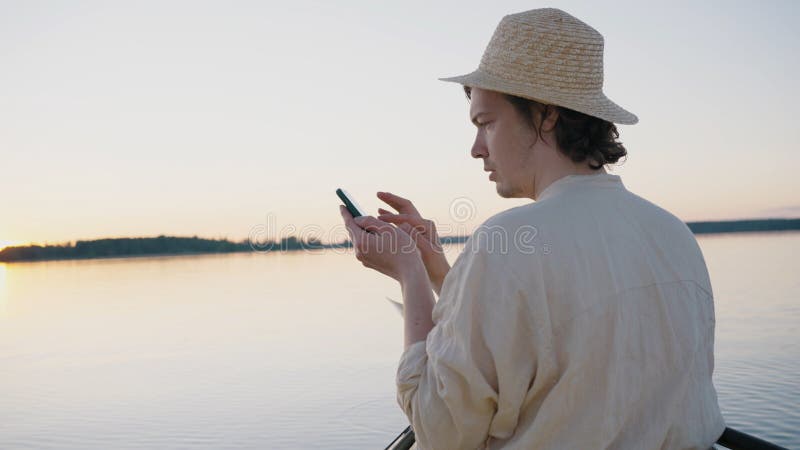 Man Tries To Get Cell Signal on Smartphone Against Lake Stock Image ... Man Tries To Get Cell Signal on Smartphone Against Lake Stock Image ...