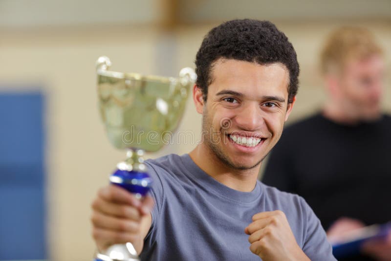 Man with trophy on hands stock image. Image of euphoria - 258028735