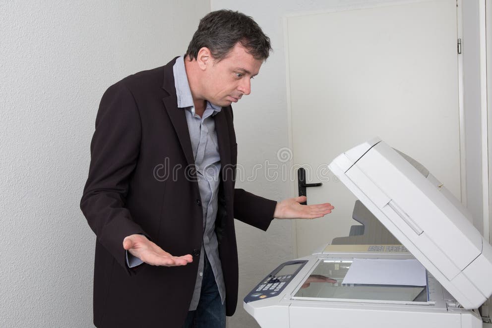 Man in Trouble with the Copy Machine Stock Photo - Image of upset ...