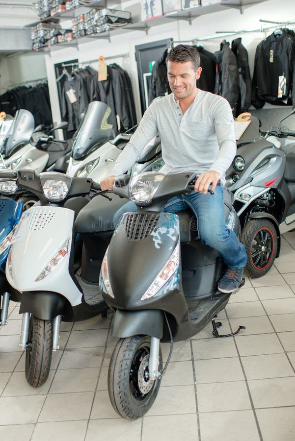 Man trying scooter stock photo. Image of sitting, handsome - 296718248
