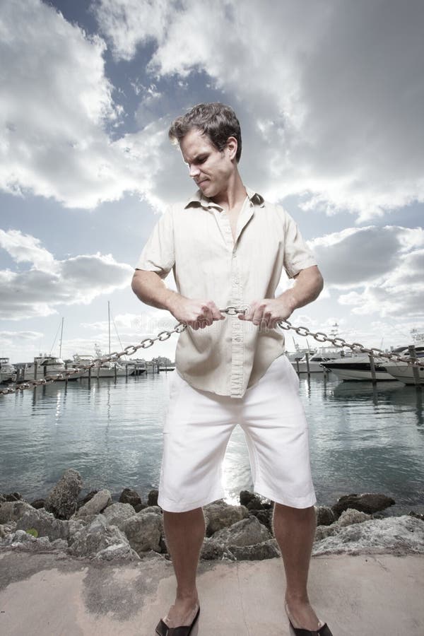 Man Trying To Break the Chains Stock Photo - Image of glare, caucasian ...