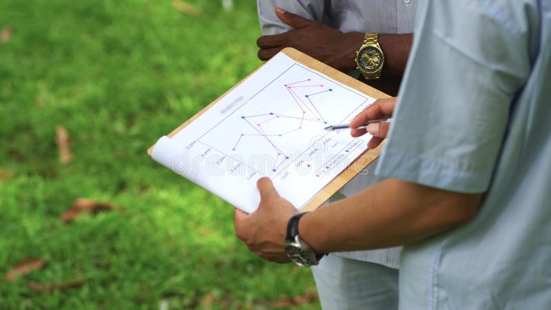 A Man Explaining Information from a Sheet To His Co Worker Stock Video ...
