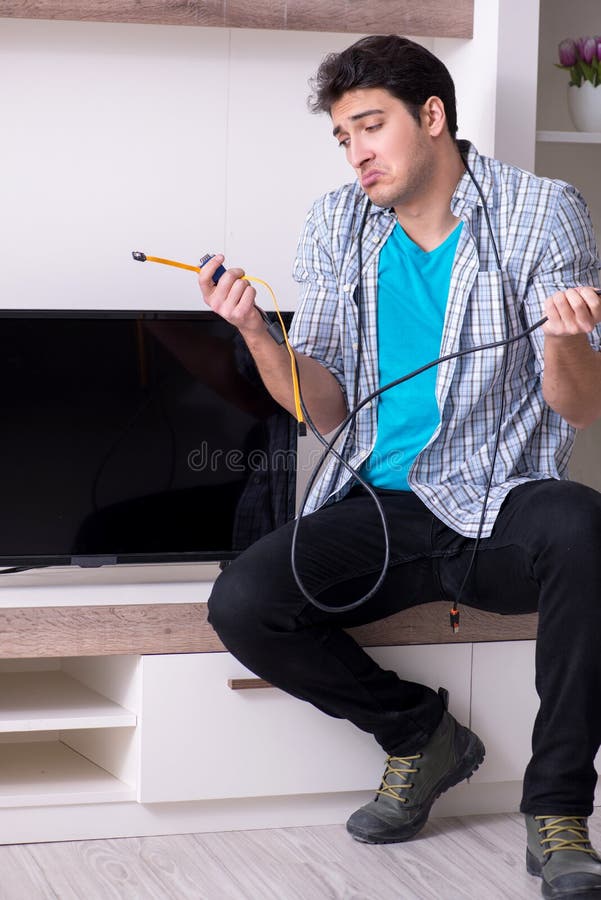 The Man Trying To Fix Broken Tv Stock Image - Image of repairman ...