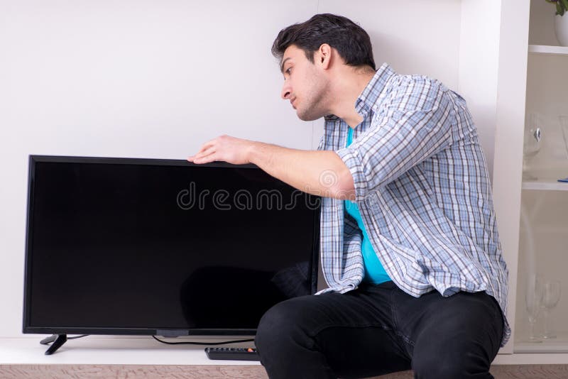 The Man Trying To Fix Broken Tv Stock Photo - Image of electrical ...