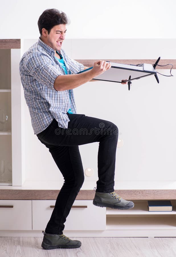 Man Trying To Fix Broken Tv Stock Photo - Image of maintenance ...