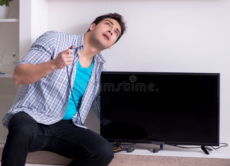 Man Trying To Fix Broken Tv Stock Photo - Image of electric ...