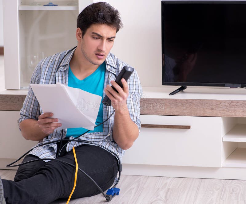Man Trying To Fix Broken Tv Stock Image - Image of connecting, fixing ...