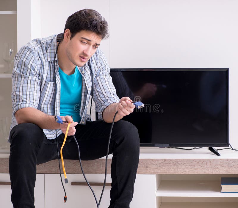 Man Trying To Fix Broken Tv Stock Image - Image of installation ... Man Trying To Fix Broken Tv Stock Image - Image of installation ...