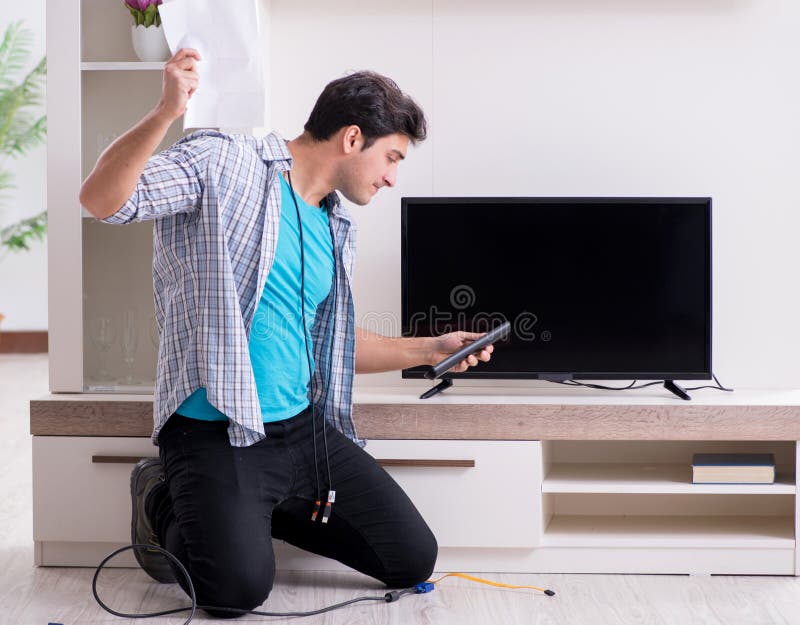 Man Trying To Fix Broken Tv Stock Image - Image of repairing, handyman ...