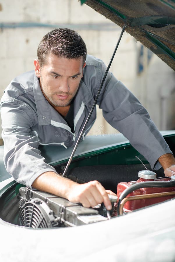 Man trying to fix car stock image. Image of workshop - 74870887