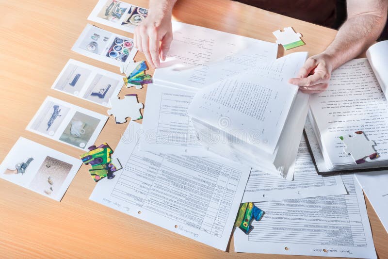 Man Trying To Solve a Puzzle Reading Books Stock Photo - Image of ...
