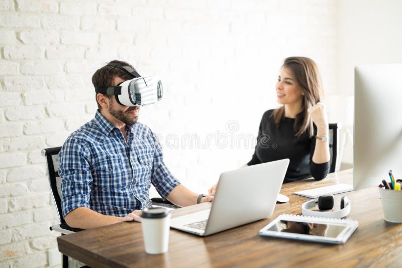 Man trying VR glasses stock photo. Image of desk, hispanic - 101734284