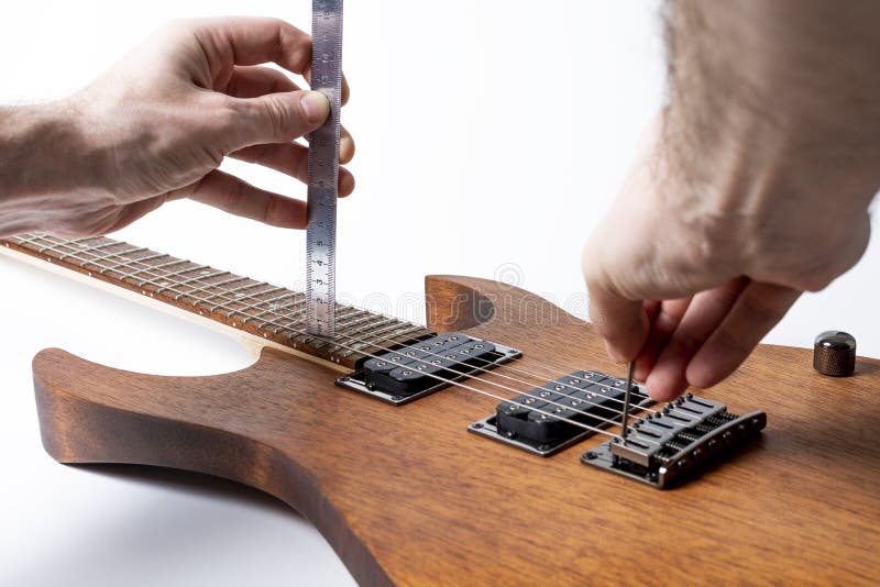 Tuning a New Electric Guitar Using Measuring Instruments Stock Image ...