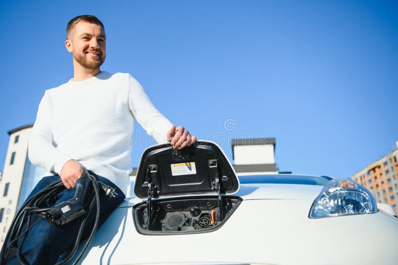 Man Turning on Charging of Car Stock Image - Image of renewable, green ...