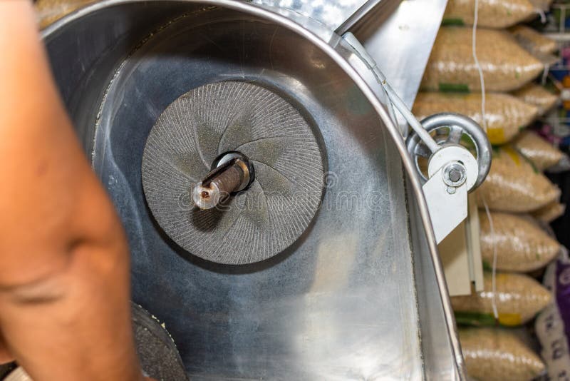 Man Turning His Back Preparing a Nixtamal Mill To Start Making Dough ...