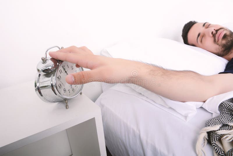 Man Turning Off Alarm Clock. Stock Photo - Image of early, lifestyle ...