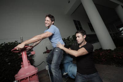 Man turning the valve stock image. Image of holding, team - 10261359