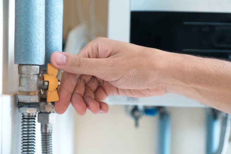 Man Turning on Valve of Gas Boiler, Closeup Stock Photo - Image of pipe ...