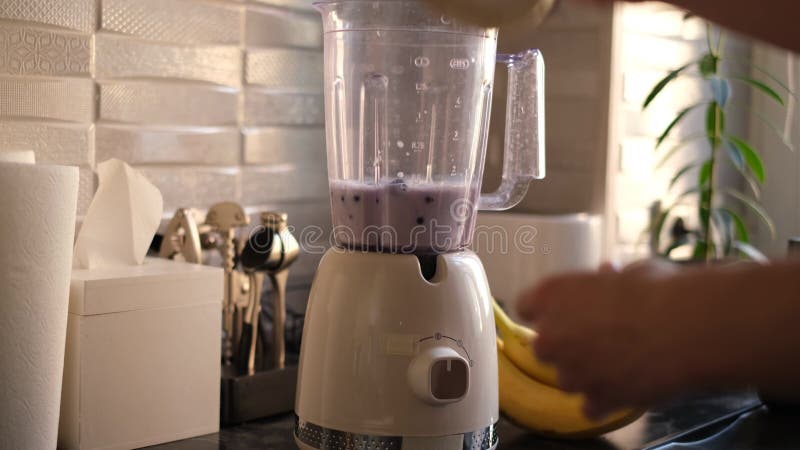 A Man Turns on a Blender To Make a Berry Smoothie Stock Footage - Video ...