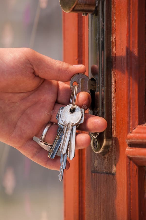 The Man Turns the Key in the Lock Stock Photo - Image of open, front ... The Man Turns the Key in the Lock Stock Photo - Image of open, front ...