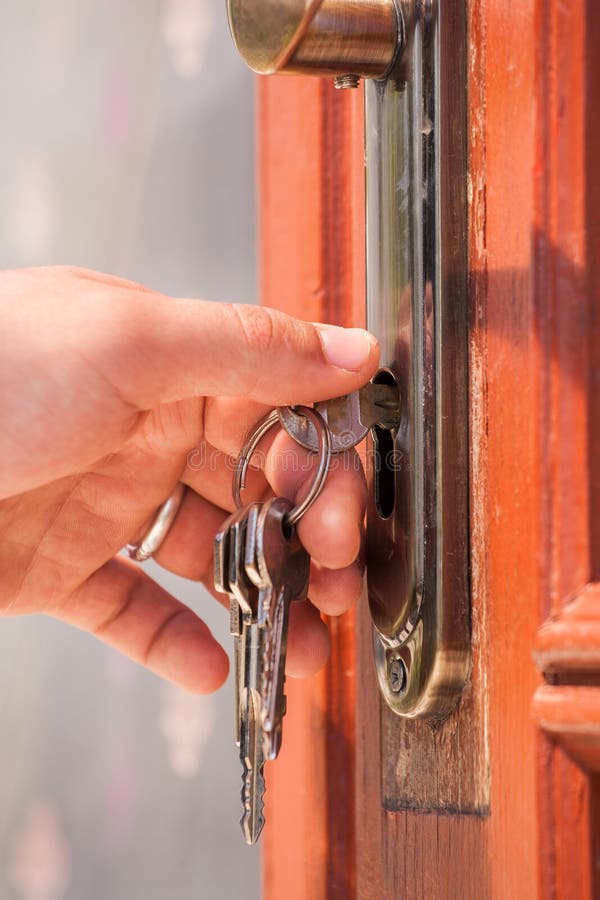 The Man Turns the Key in the Lock Stock Photo - Image of home, open ... The Man Turns the Key in the Lock Stock Photo - Image of home, open ...