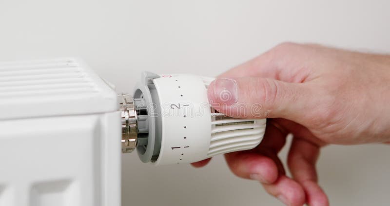 The Man Turns Off the Heating by Setting the Thermostat Stock Video ...