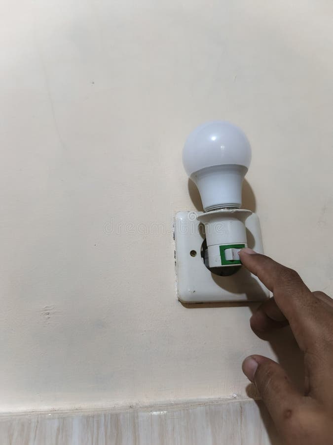 A Man Turns Off the Light Switch in the Room Stock Photo - Image of ...