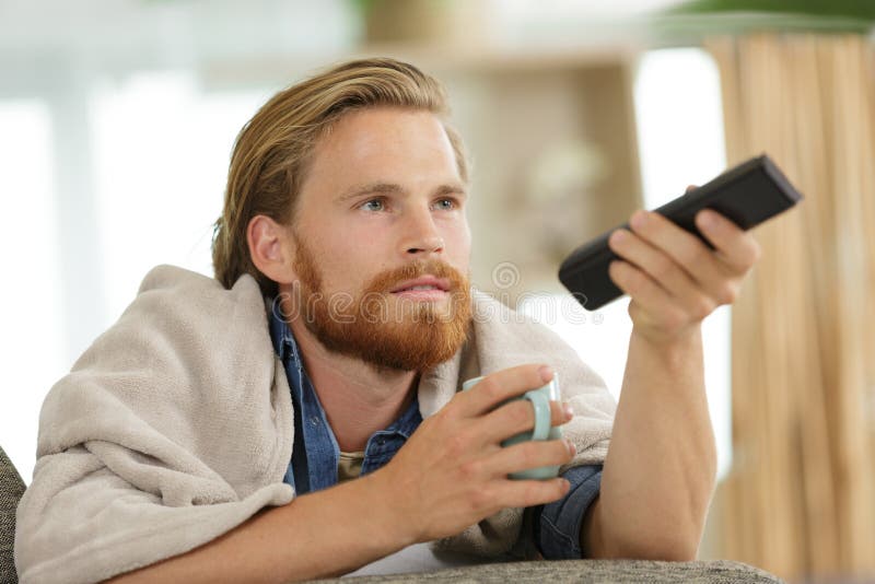 Man with Tv Remote Control at Home Stock Image - Image of male, casual ...