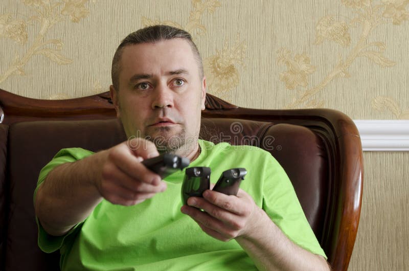 Man with a TV Remote Control Stock Image - Image of portrait ...