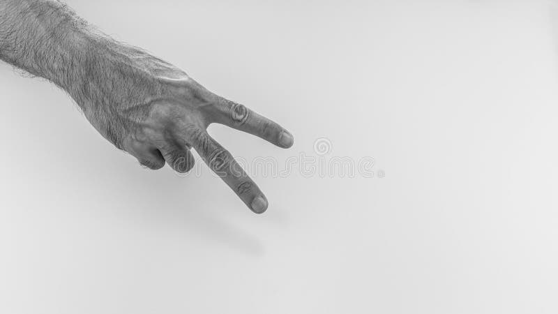 A Man with Two Fingers, Hand Gesture Sign on White Background. Two ...
