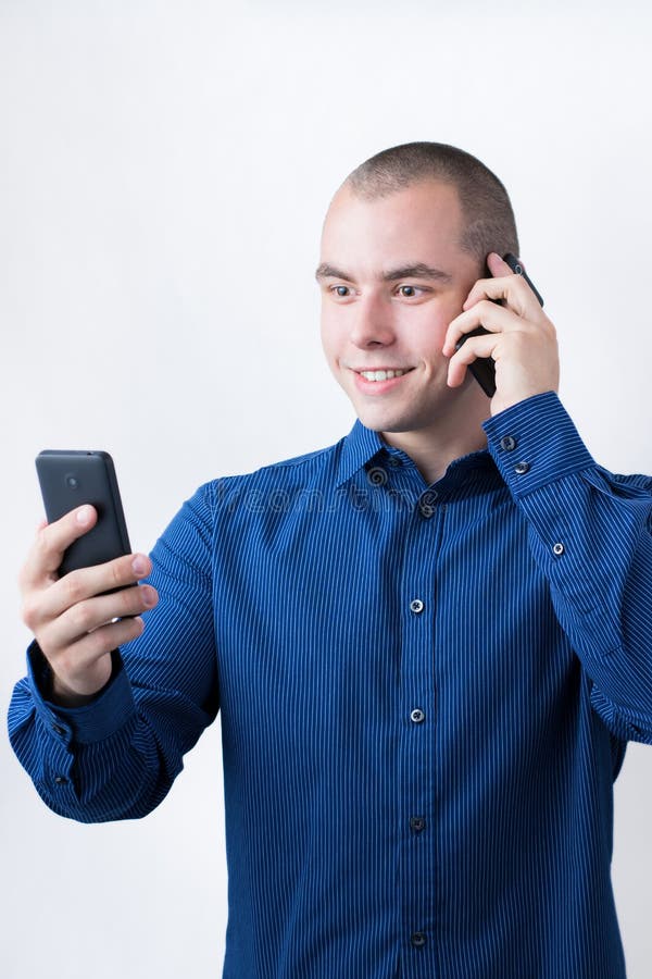 Man with two smart phones stock photo. Image of modern - 55645860