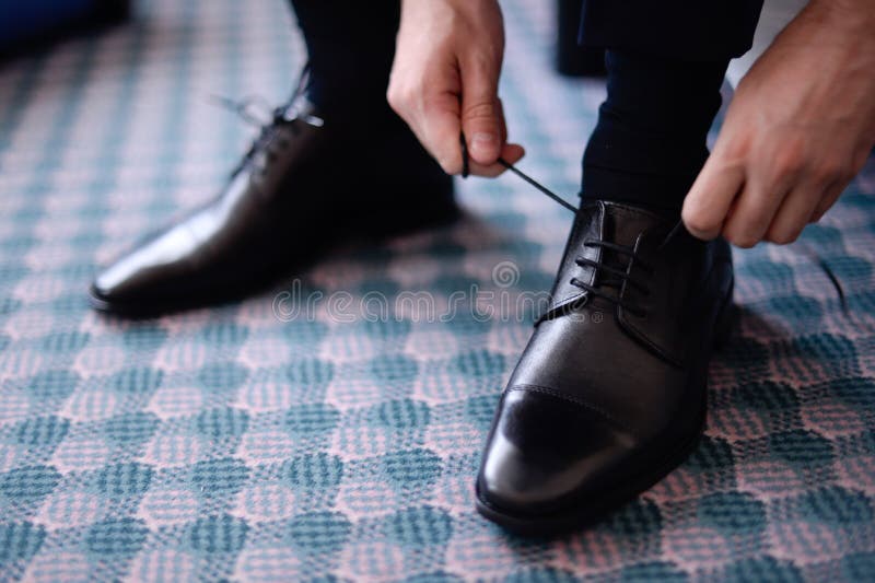 Man Tying His Black Leather Shoes Stock Image - Image of light, classic ...