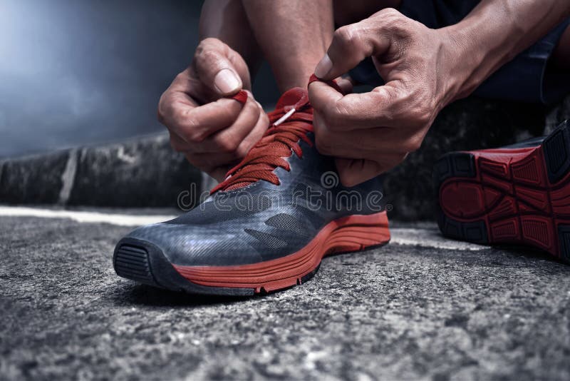 Man tying running shoes stock photo. Image of prepare - 96647666